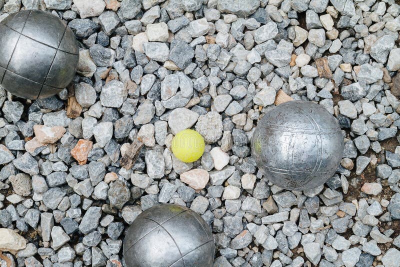 Petanque Balls and the Yellow Wood Jack Stock Photo - Image of metallic ...