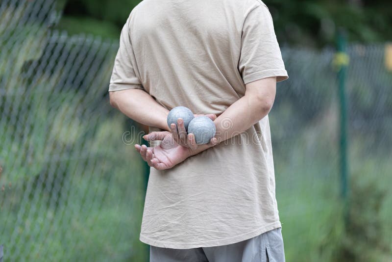 Petanque Player Holds the Balls Behind His Back Stock Image - Image of ...