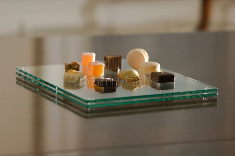 Petit Fours on a Modern Glass Plate Stock Photo - Image of caramel ...