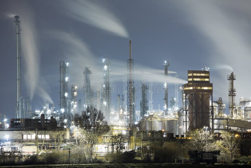 Petrochemical Factory by Night Using Gas Causing Global Warming and ...