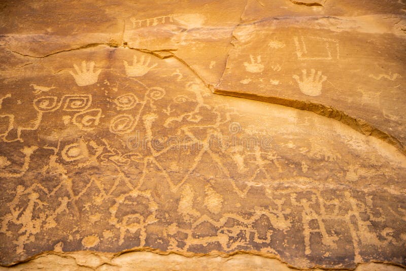 Petroglyphs Carved into Rocks Above Cliff Dwelling Stock Image - Image ...