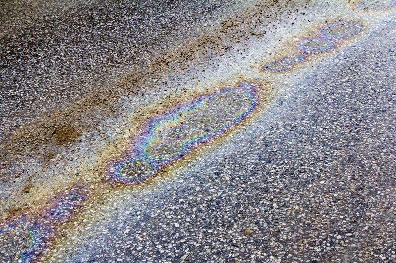 Petrol Spill on Road Surface Stock Photo - Image of leak, spill: 17073880