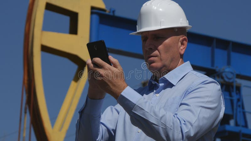 Petroleum Engineer Working in Extracting Oil Industry Using Mobile ...