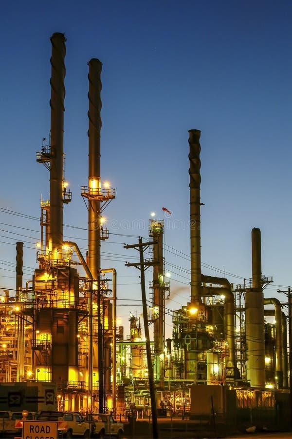 Petroleum Oil Refinery at Sunset with Lights on Stock Image - Image of ...