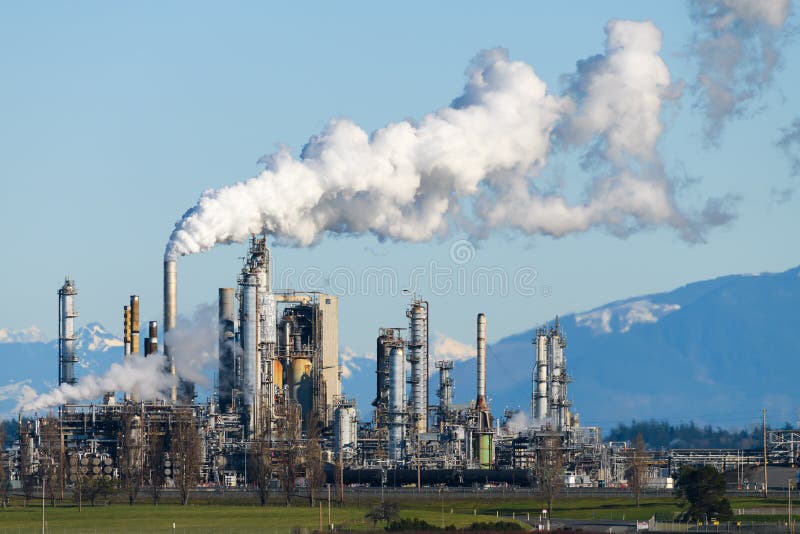 Petroleum Processing Refinery with Plume of Steam Drifting Stock Image ...