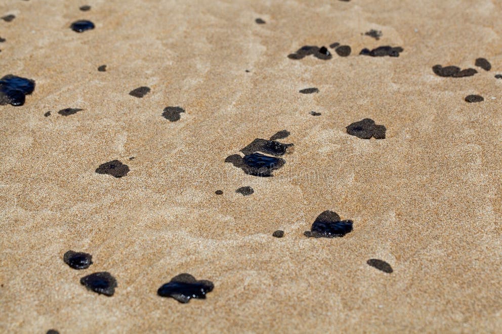 Petroleum stains on sand stock image. Image of environment - 299757579