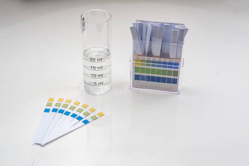 Ph Control Strips, Graduated Cylinder with Water and Box of Strips with ...