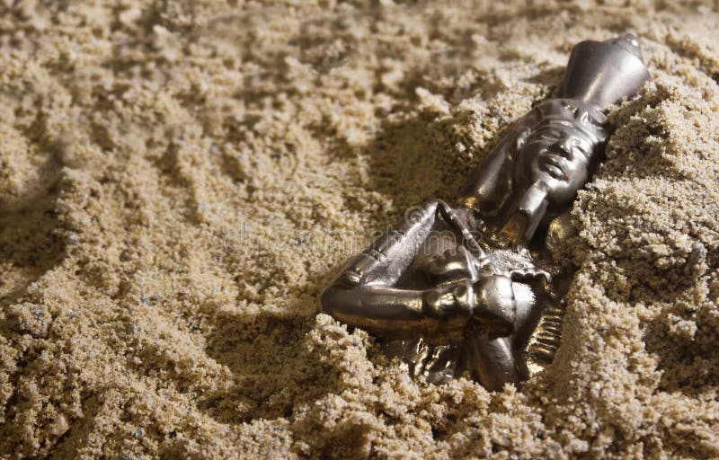 Pharaoh Metal Statuette Laying in Sand. Stock Photo - Image of egypt ...