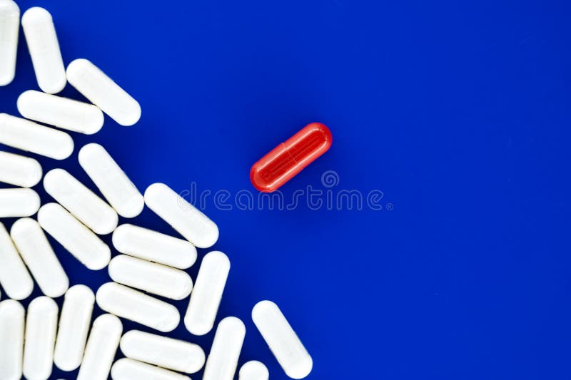 Pharmaceutical Capsule Pills Scattered on Blue Background Stock Photo ...