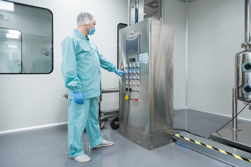 Pharmaceutical Factory Man Worker in Protective Clothing Working with ...