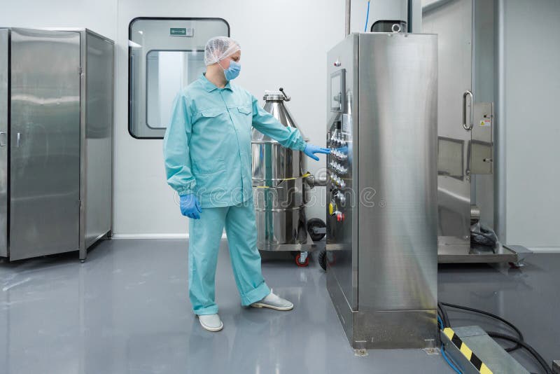 Pharmaceutical Factory Man Worker in Protective Clothing Working with ...