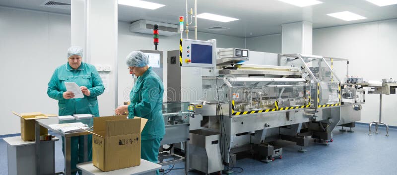 Pharmaceutical Factory Workers in Sterile Environment Stock Image ...