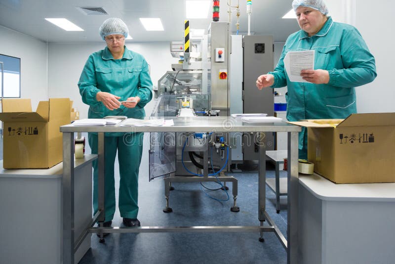 Pharmaceutical Factory Workers in Sterile Environment Stock Image ...
