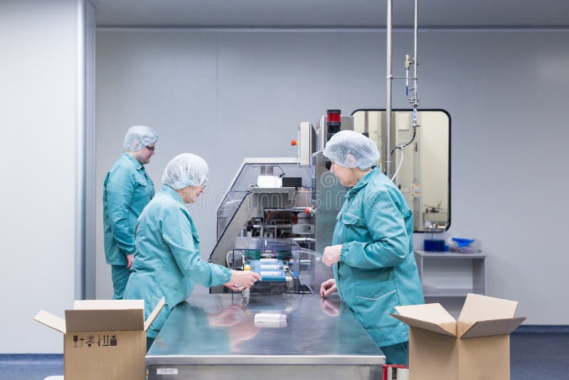 Pharmaceutical Factory Workers in Sterile Environment Stock Photo ...