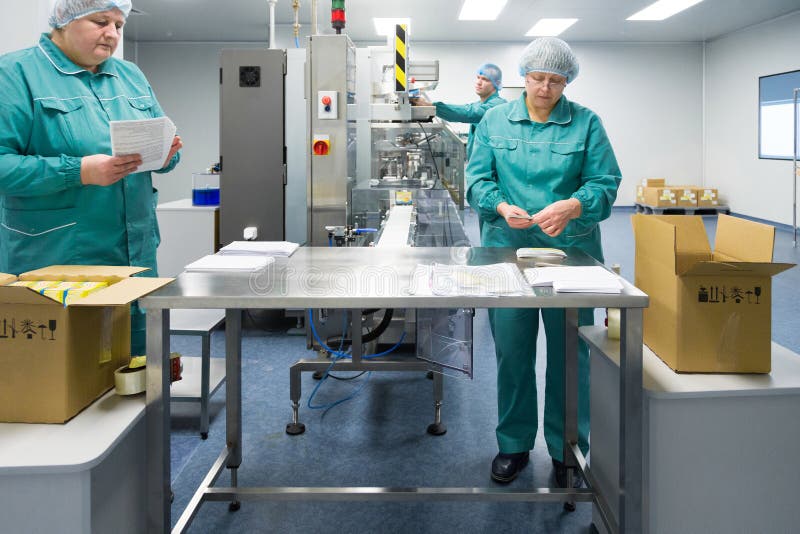 Pharmaceutical Factory Workers in Sterile Environment Stock Image ...