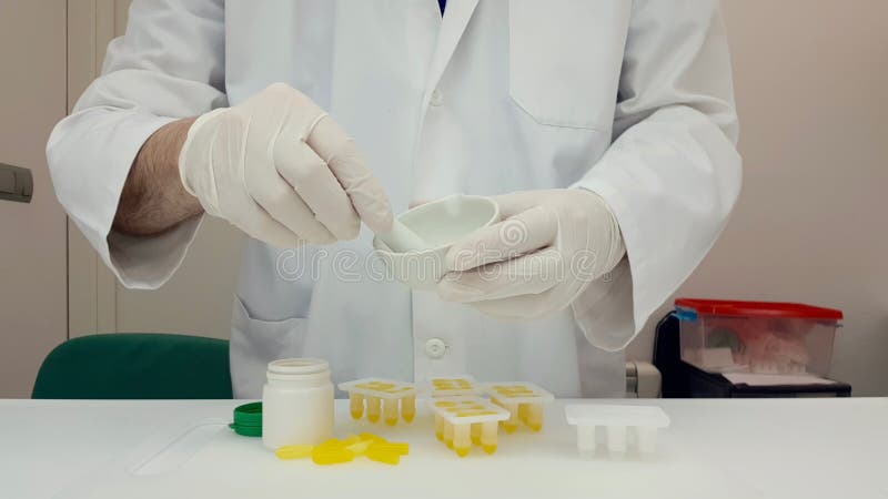 Pharmaceutical Making Yellow Suppositories Stock Photo - Image of ...