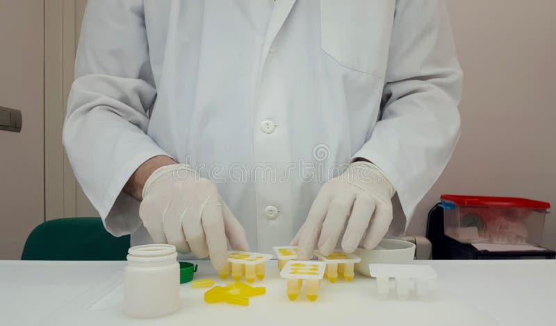 Pharmaceutical Making Yellow Suppositories Stock Image - Image of ...