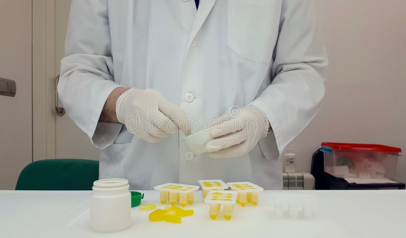 Pharmaceutical Making Yellow Suppositories Stock Photo - Image of ...