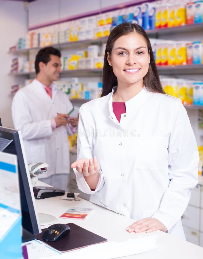Pharmaceutists at Reception of Drugstore Ready To Help Stock Image ...