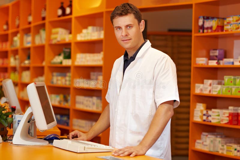 Pharmacist behind counter stock photo. Image of pharmacy - 21711304