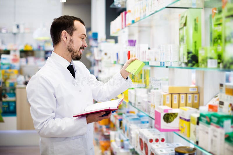 Pharmacist Checking Drugs in Pharmacy Stock Image - Image of advising ...