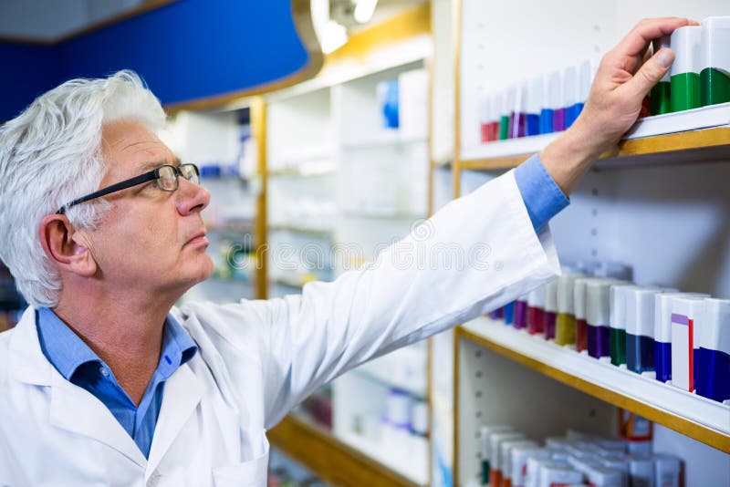 Pharmacist Checking Medicines in Pharmacy Stock Photo - Image of ...