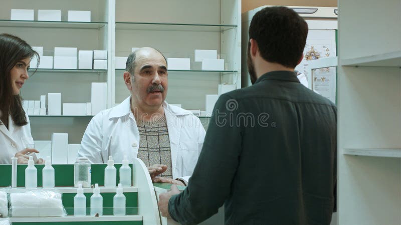 Pharmacist and Client Have Conflict and Try To Solve the Problem at ...