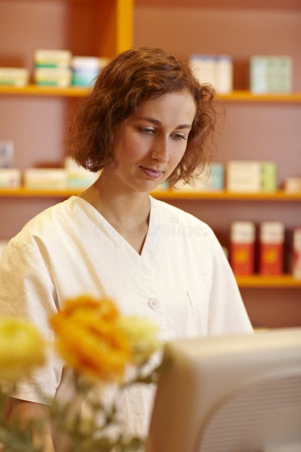 Pharmacist at the computer stock photo. Image of online - 12113824