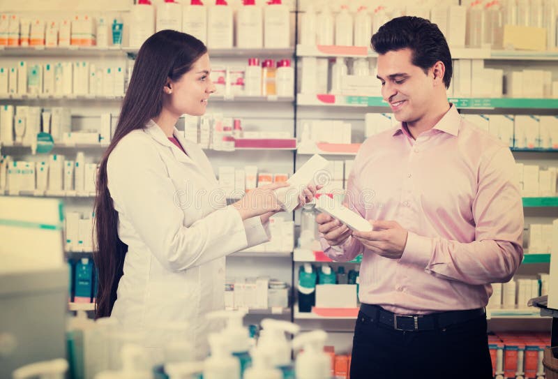 Pharmacist and Consulting Man in Pharmacy Stock Image - Image of ...