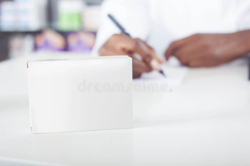 Pharmacist or Doctor Writing with Green Tablet Package with Copy Space ...