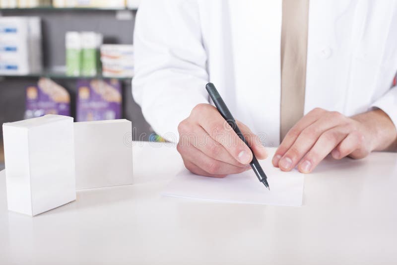 Pharmacist or Doctor Writing with Tablet Package with Copy Space Stock ...
