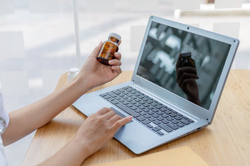 The Pharmacist is Entering the Information of the Medicines Received ...