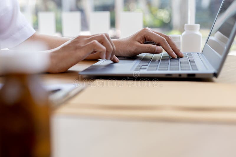 The Pharmacist is Entering the Information of the Medicines Received ...