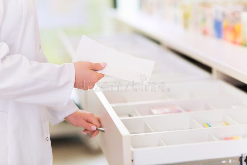 Pharmacist Filling Prescription Stock Photo - Image of pharmacist, open ...