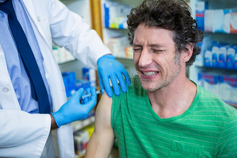 Pharmacist Giving Injection To Patient Stock Image - Image of ...