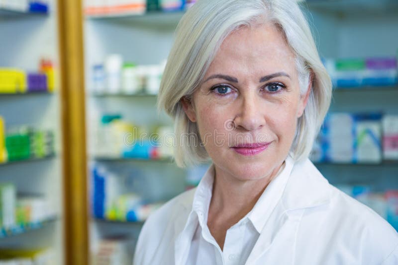 Pharmacist in lab coat stock photo. Image of pharmaceutical - 77226488