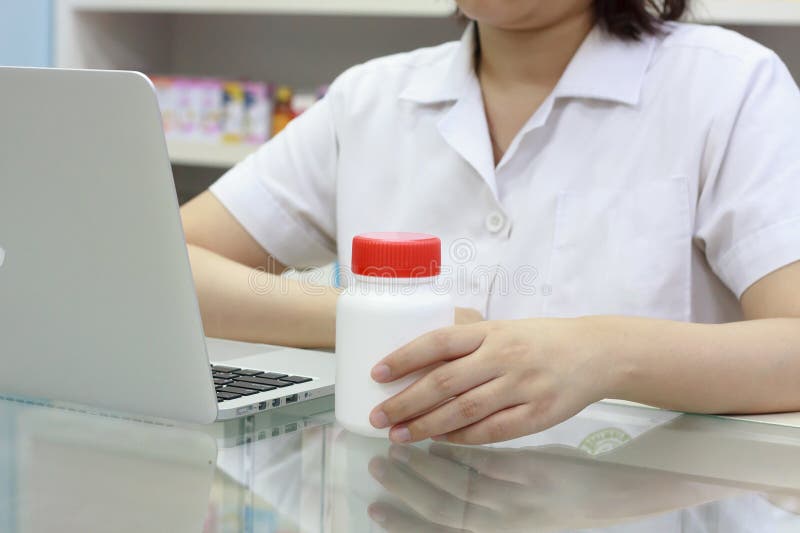 Pharmacist with Laptop Computer Stock Photo - Image of pharmaceutical ...