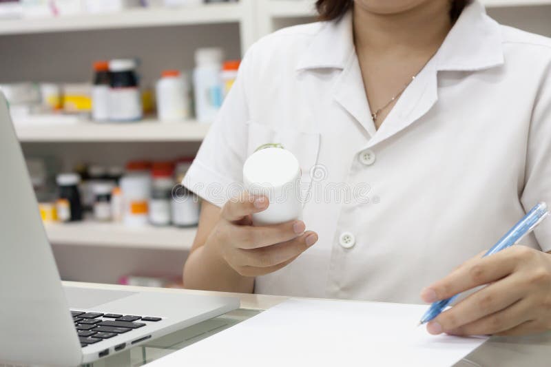 Pharmacist with Laptop Computer and Medication Stock Image - Image of ...
