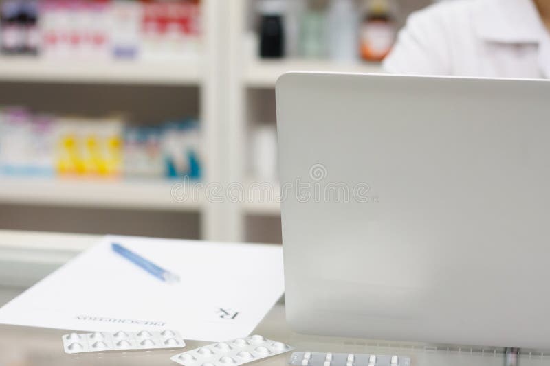 Pharmacist with Laptop Computer and Medication Stock Photo - Image of ...