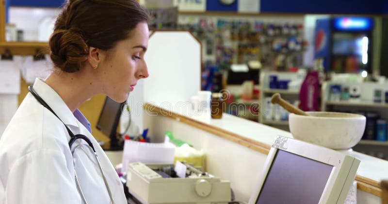 Pharmacist Making Prescription Record on Computer Stock Video - Video ...