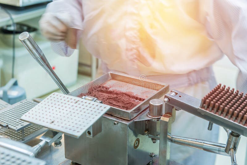 Pharmacist Preparing Medication with Packaging Capsule in Lab Stock ...