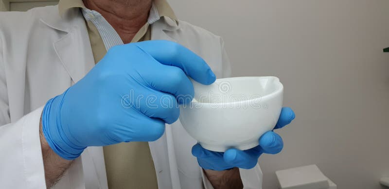 Pharmacist Preparing a Medicine in Capsules Using a Capsule Making ...
