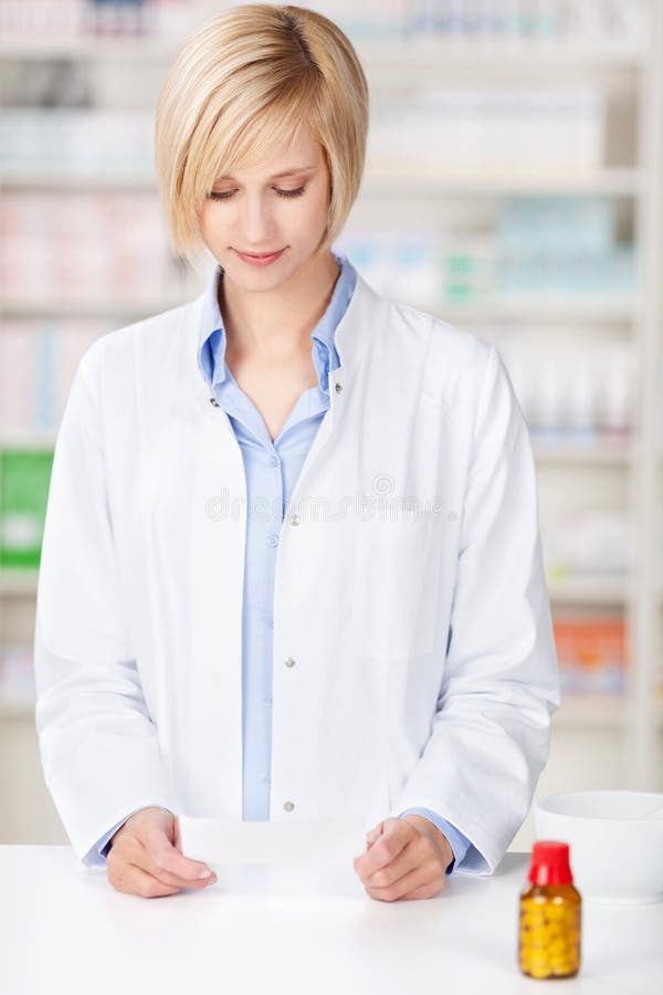 Pharmacist Reading Prescription Paper Stock Image - Image of chemist ...