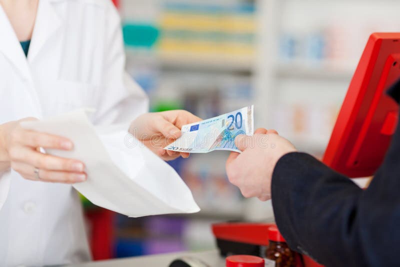 Pharmacist Receiving Money from Customer for Medicines Stock Photo ...