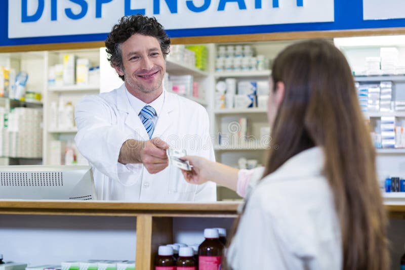 Pharmacist Receiving Payment from Customer Stock Image - Image of ...