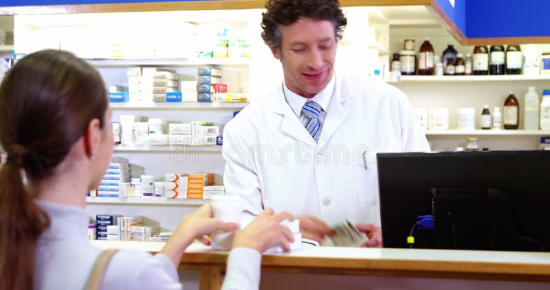 Pharmacist Receiving Payment from Customer Stock Footage - Video of ...
