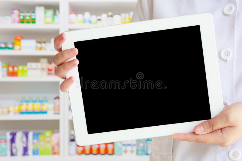 Pharmacist Showing Tablet Computer in the Pharmacy Stock Image - Image ...