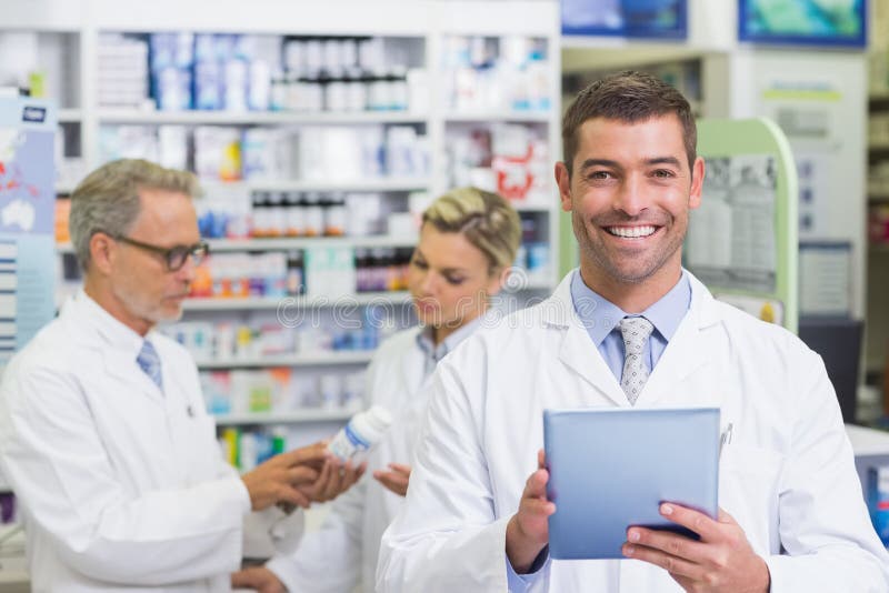 Pharmacist Smiling at Camera Stock Photo - Image of portrait ...