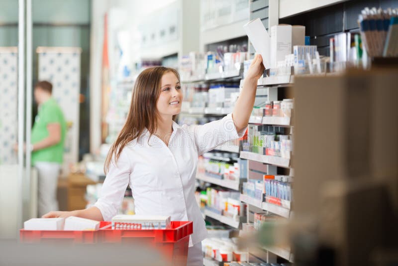 Pharmacist Stocking Shelves Stock Image - Image of happy, cheerful ...