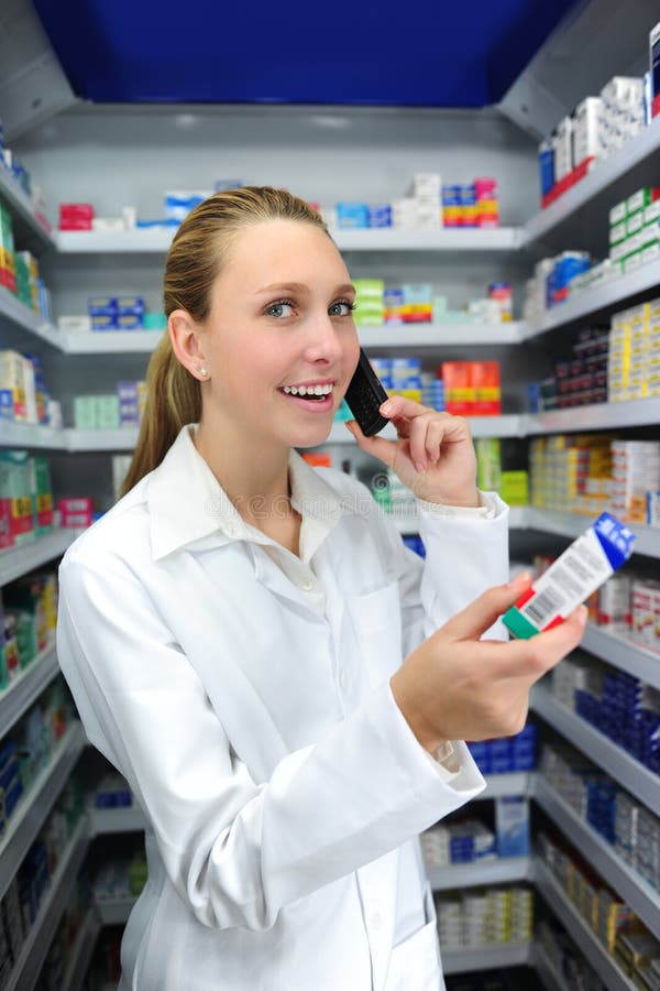 Pharmacist Talking on Phone Stock Image - Image of coat, indoors: 10669437